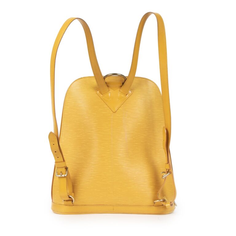 yellow backpack leather
